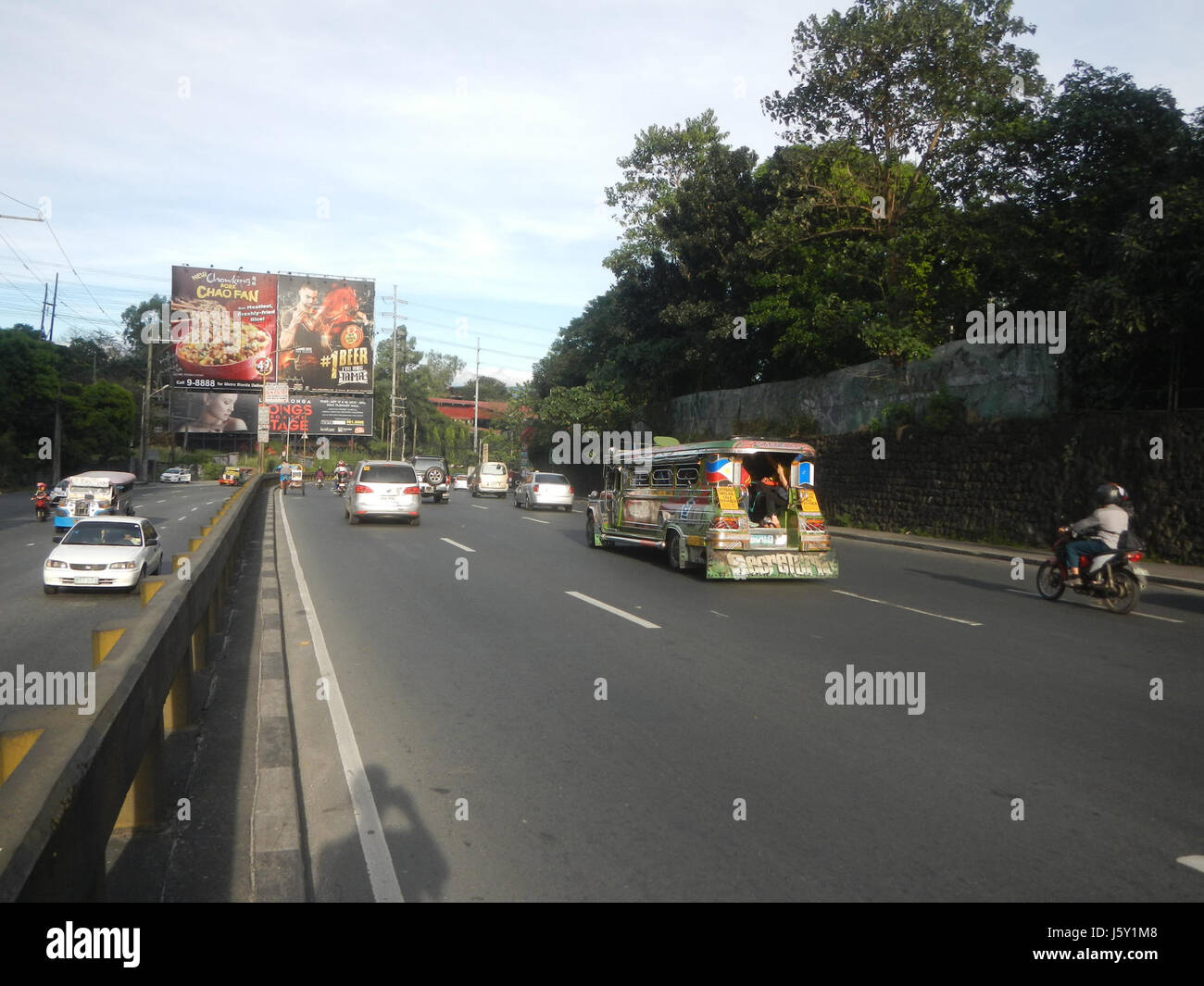 This image shows a road intersection at the boundary between Quezon ...