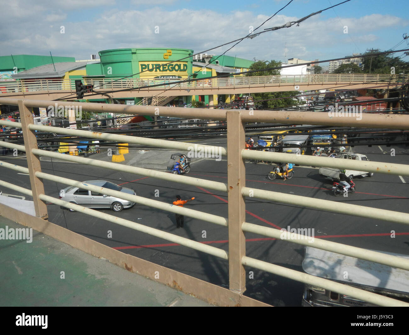 This image shows the pedestrian footbridge located near Puregold ...