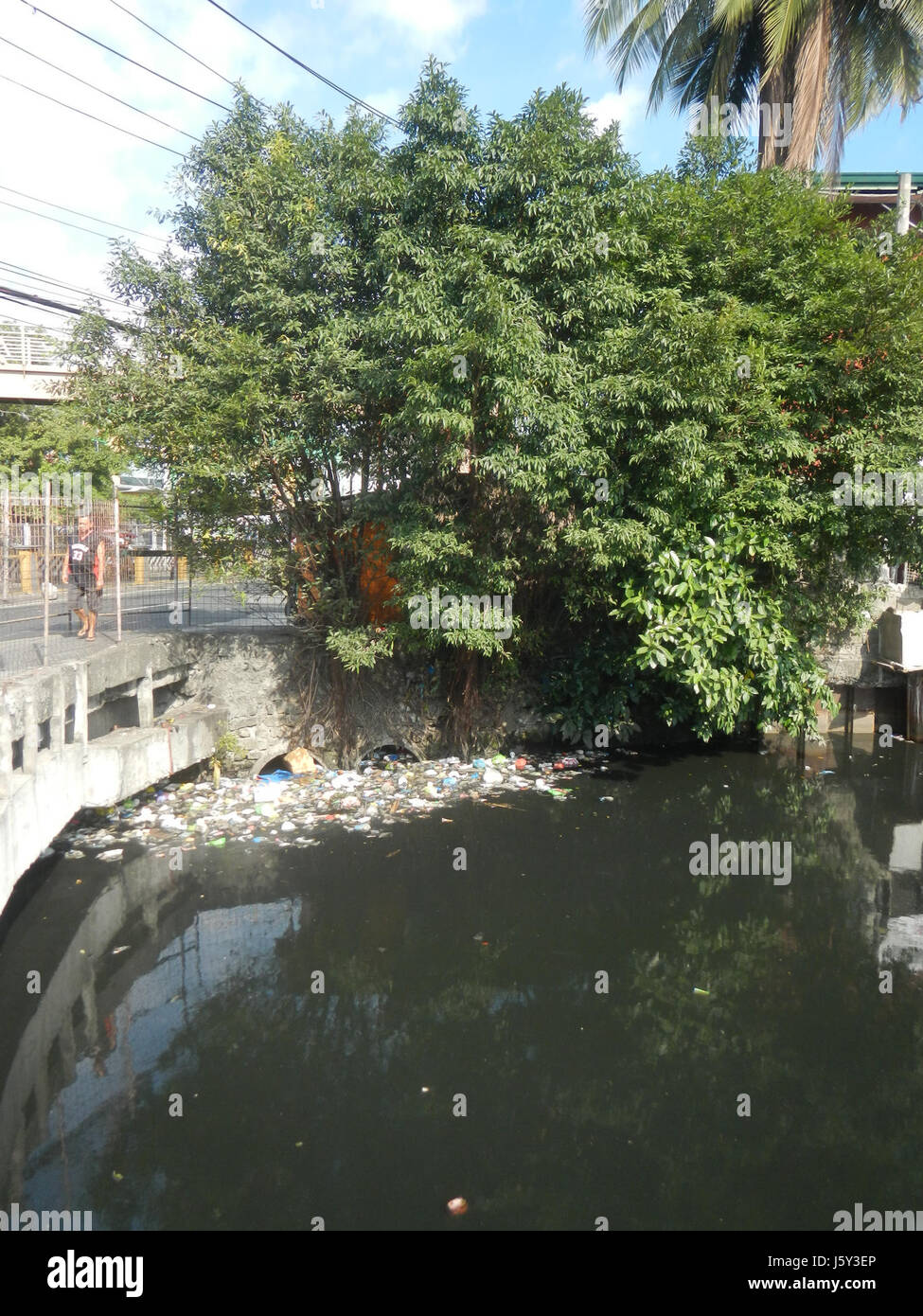 This image shows the pedestrian footbridge in the Tondo area of Manila ...