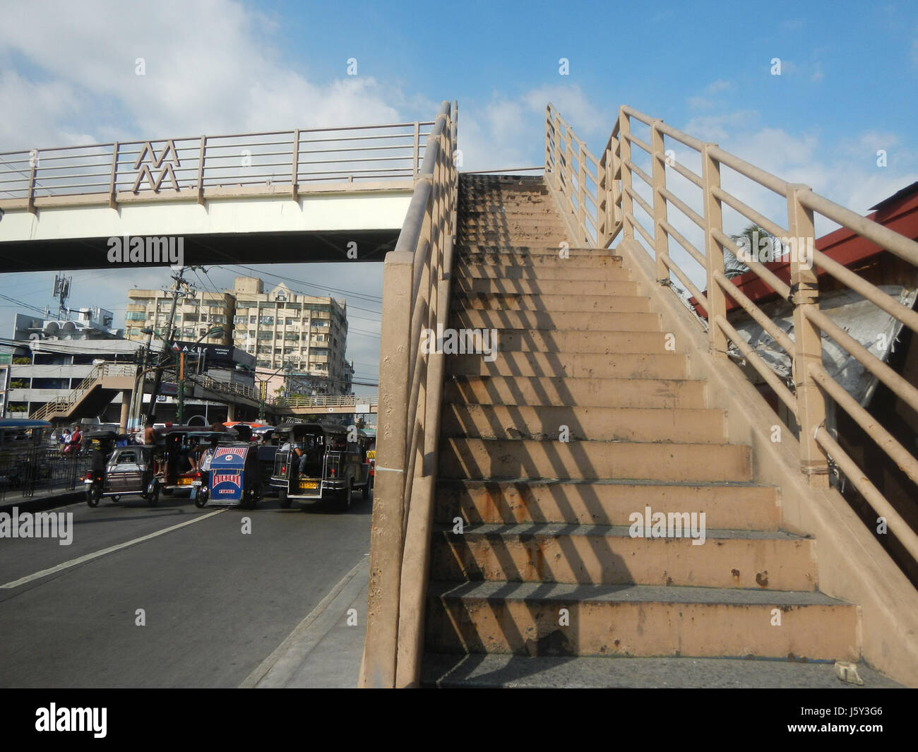 This image features the pedestrian footbridge near Tayuman and Juan ...