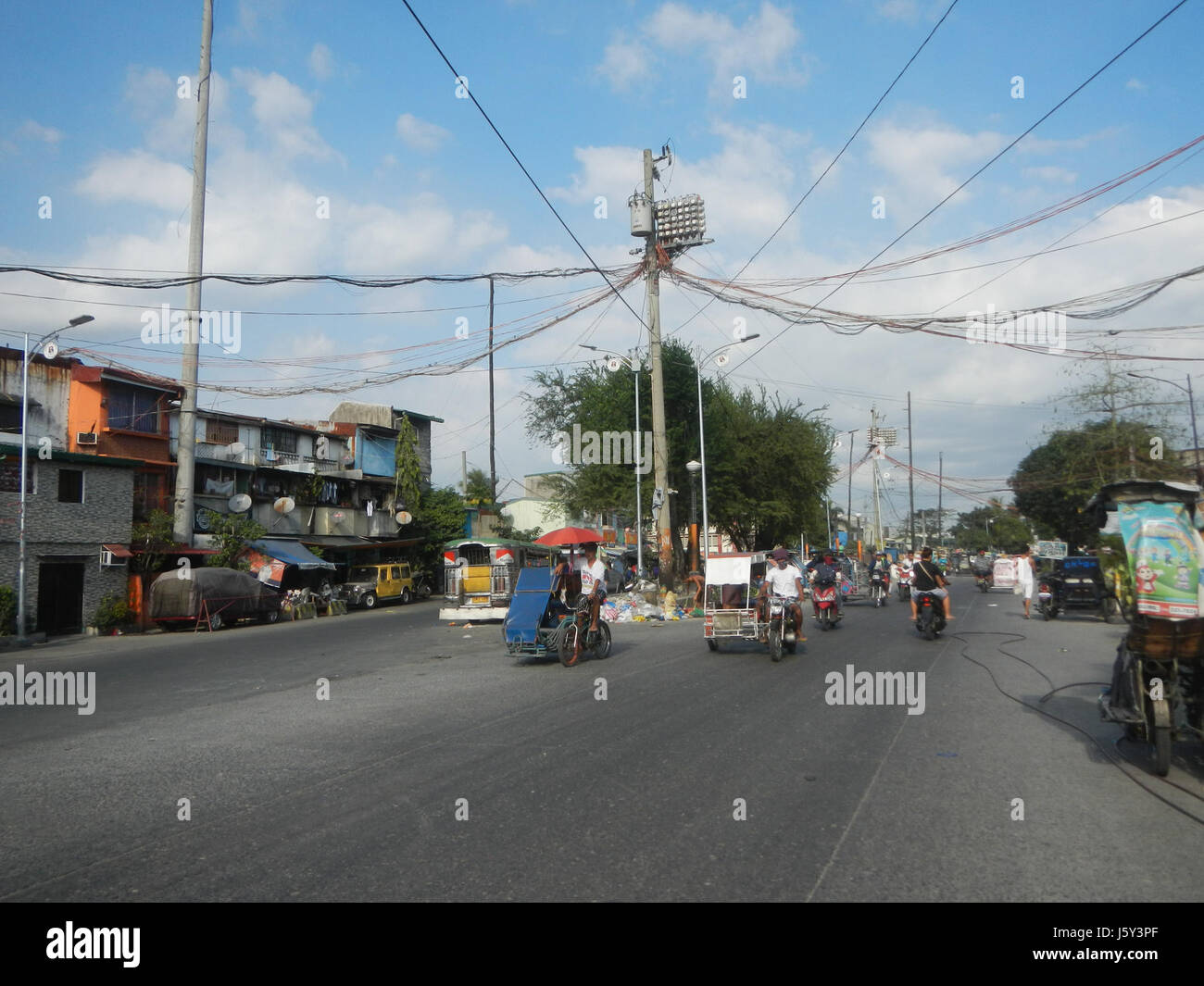 This image shows the streets of Tondo, Manila, specifically Capulong ...
