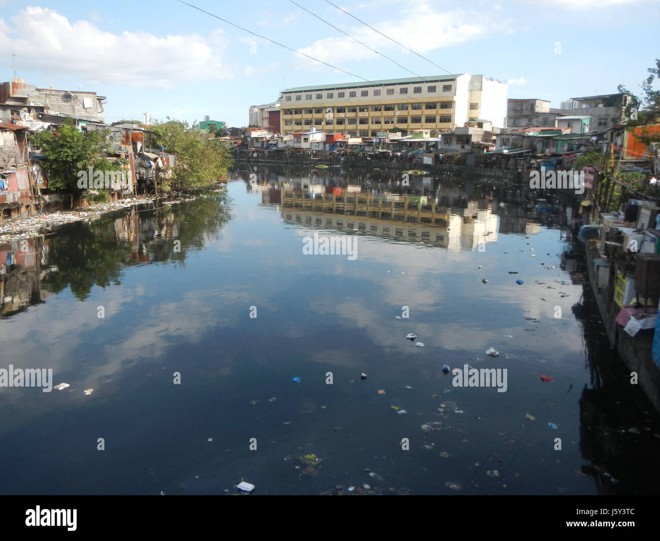 This image shows a street scene from the Tondo district in Manila ...