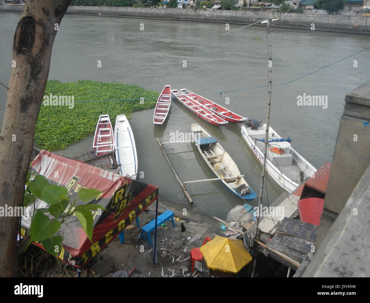 The image features Kalawaan and Bambang Bridge, spanning a river in ...