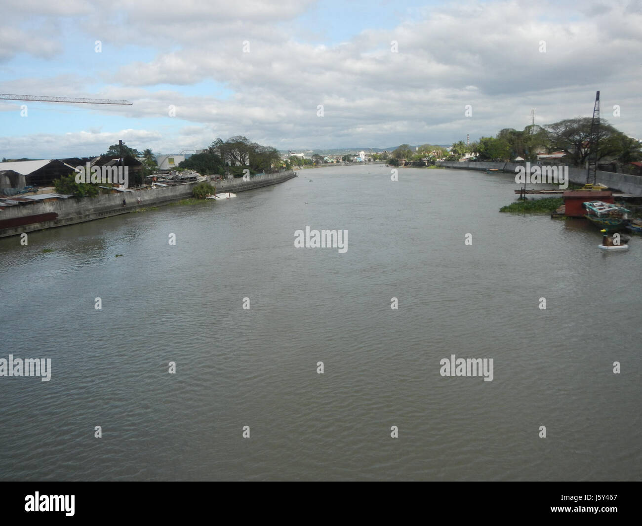 A photograph showing the Kalawaan Bambang Bridge over the Pasig River ...