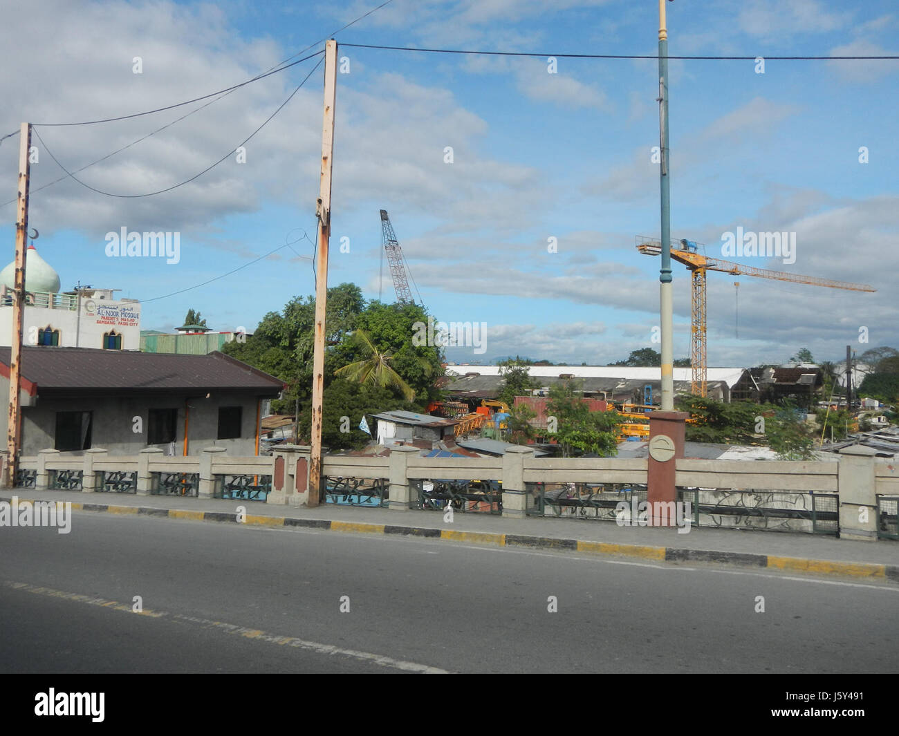 This scene showcases the Kalawaan Bambang Bridge and the Al-Noor Mosque ...