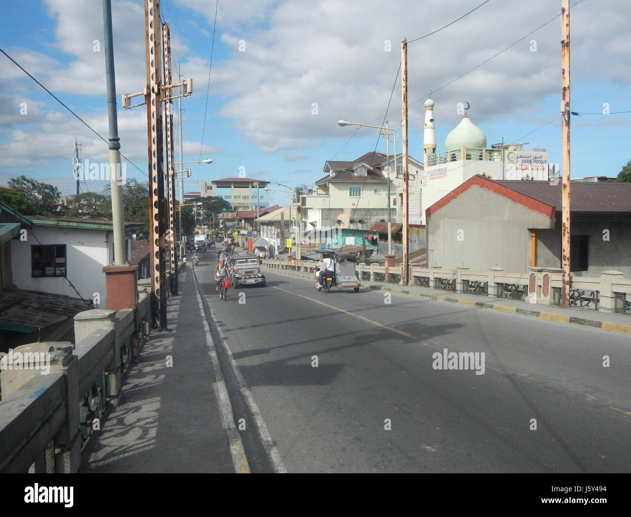 The Kalawaan Bambang Bridge spans the Pasig River in Pasig City. Nearby ...