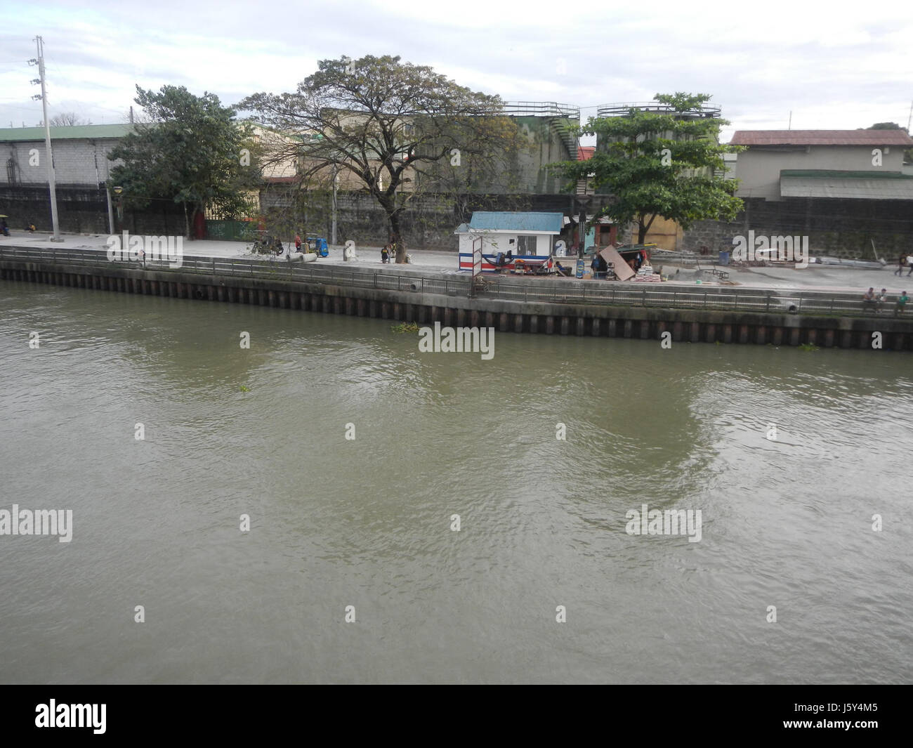 This image shows the flood control measures along the Pasig River, with ...