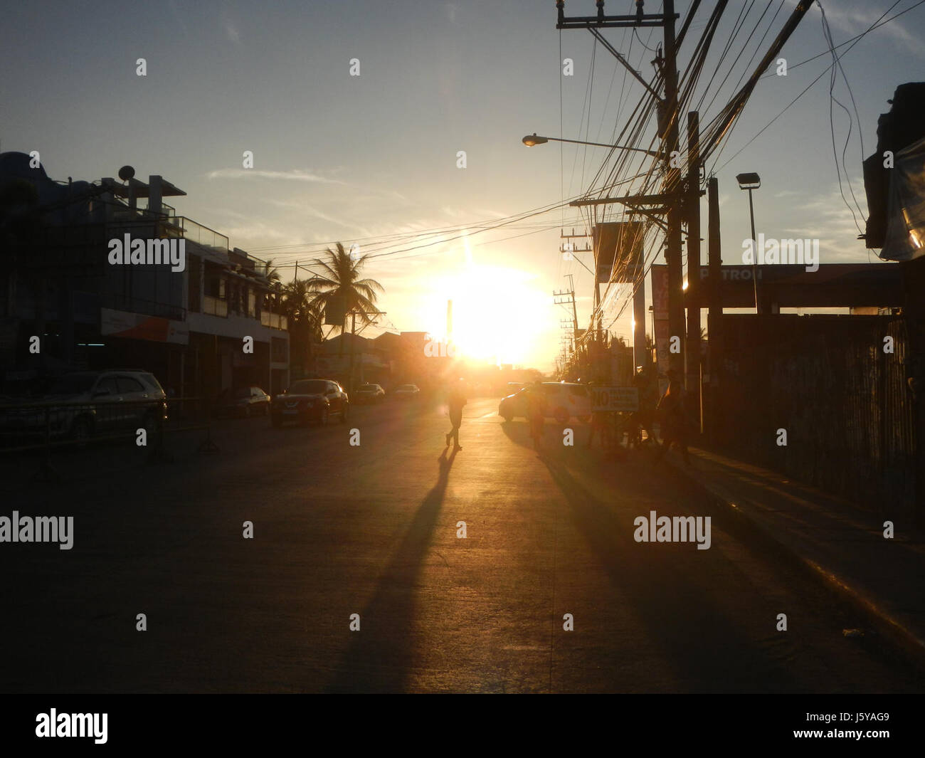 This image depicts a picturesque scene from the Daungan Tiaong Tuktukan ...