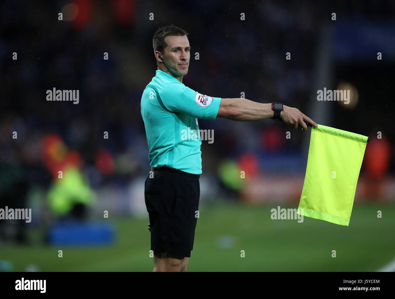 The linesman holds out his flag during the Premier League match at the ...