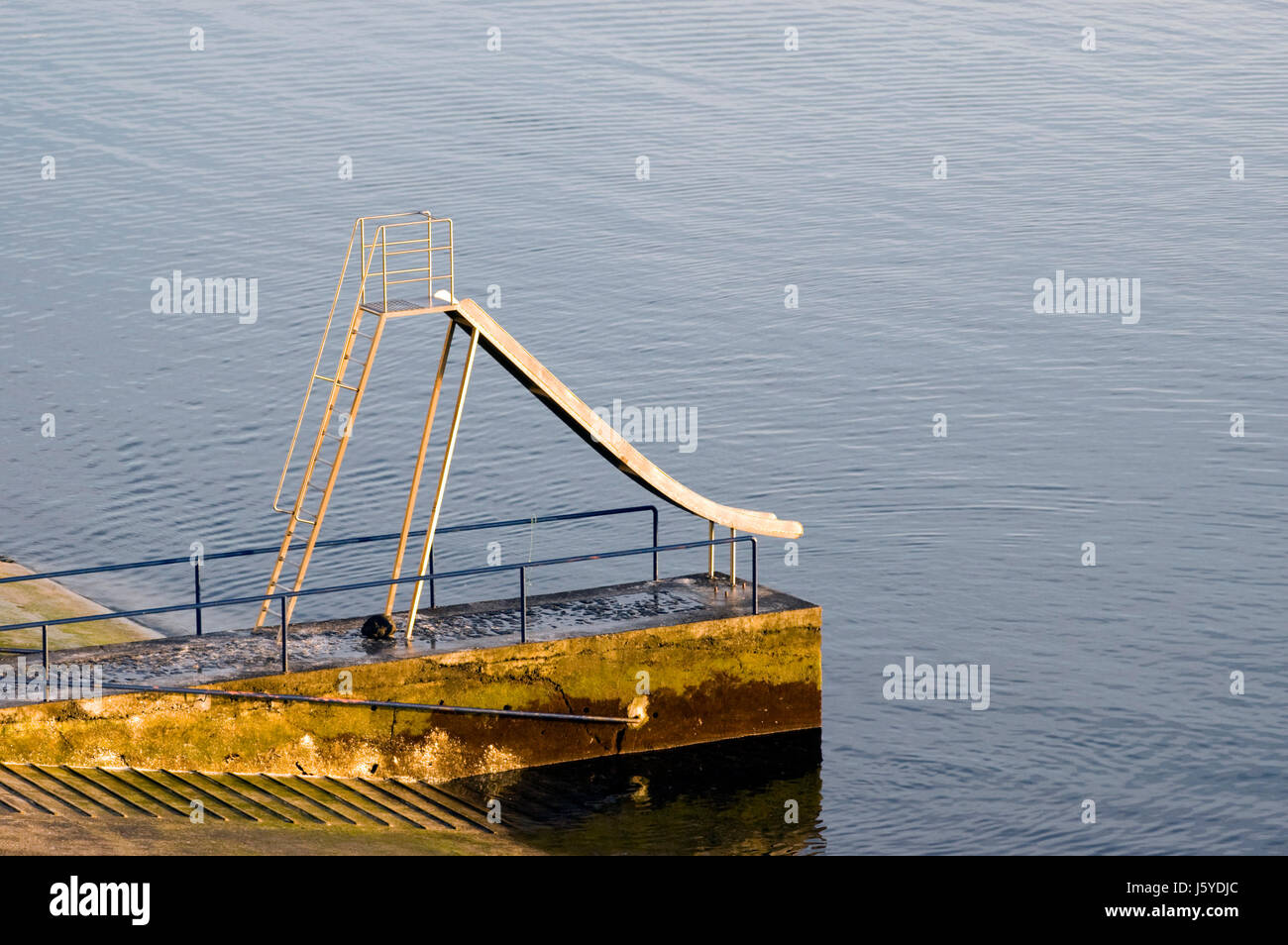 standing surface ramp nobody slide salt water sea ocean water blue ...