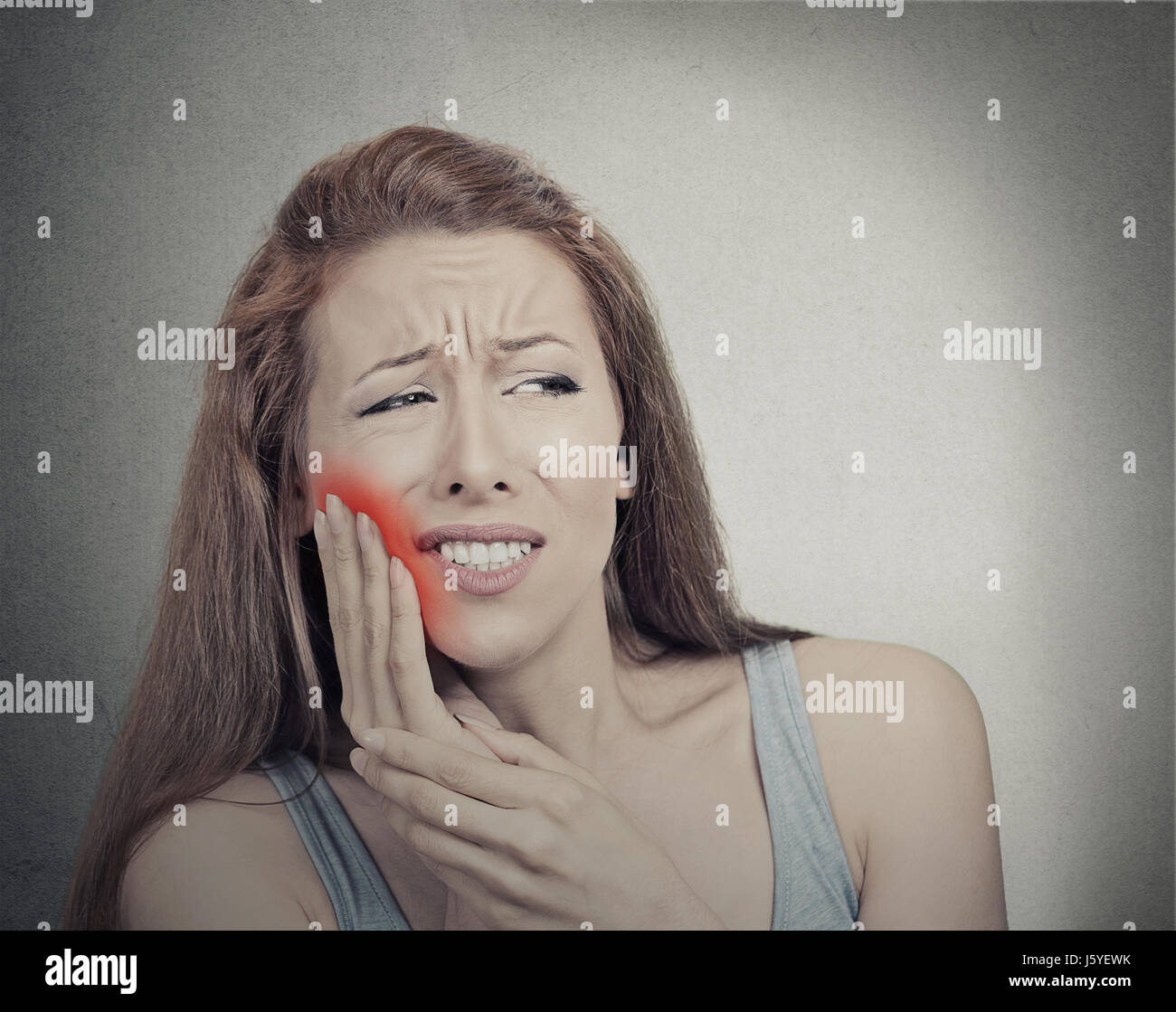 Closeup portrait young woman with sensitive tooth ache crown problem ...