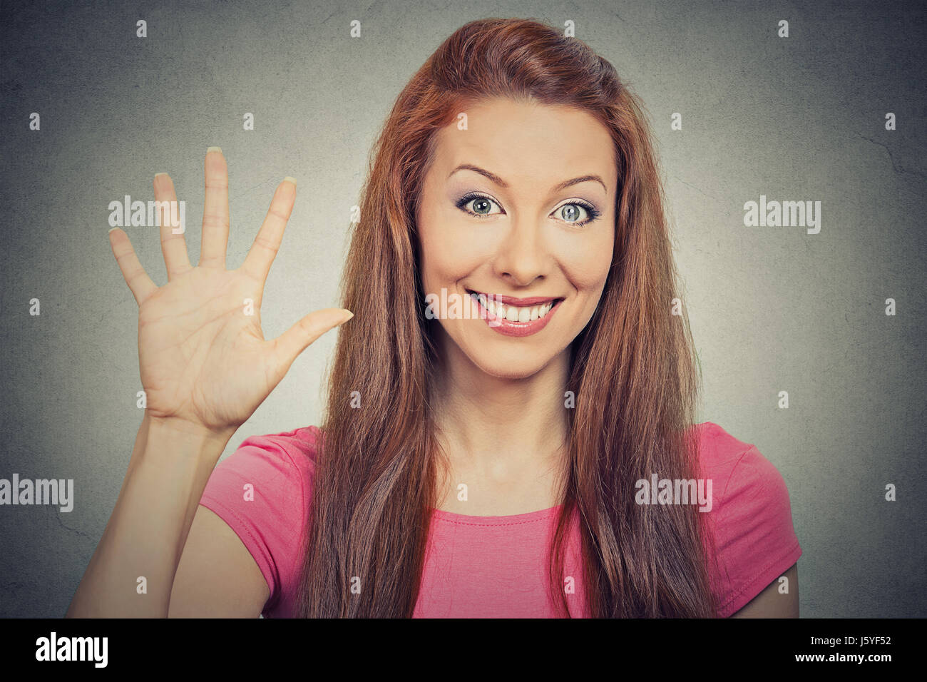 Closeup portrait, young excited woman, making five times sign gesture ...