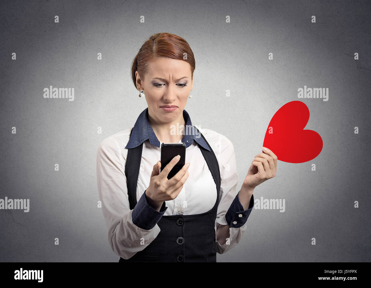 Closeup portrait offended displeased young woman reading breaking news ...
