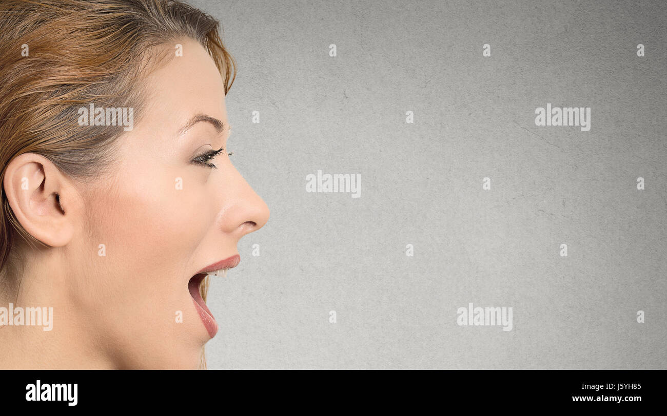 Closeup side view profile portrait headshot woman talking with sound ... Closeup side view profile portrait headshot woman talking with sound ...