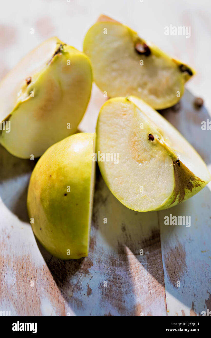 Green apple cut in quarter Stock Photo - Alamy