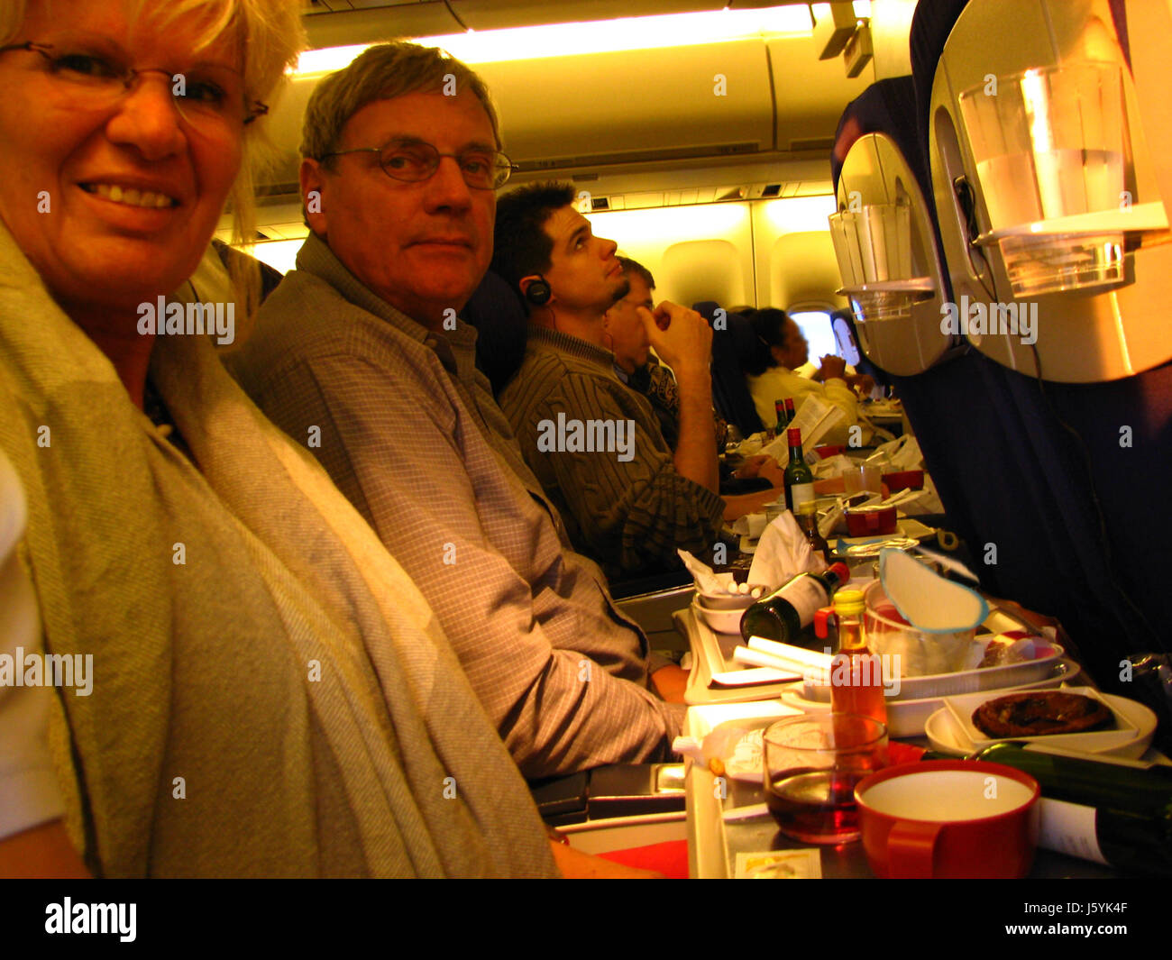 son passengers daddies fathers aircraft aeroplane plane airplane eating ...