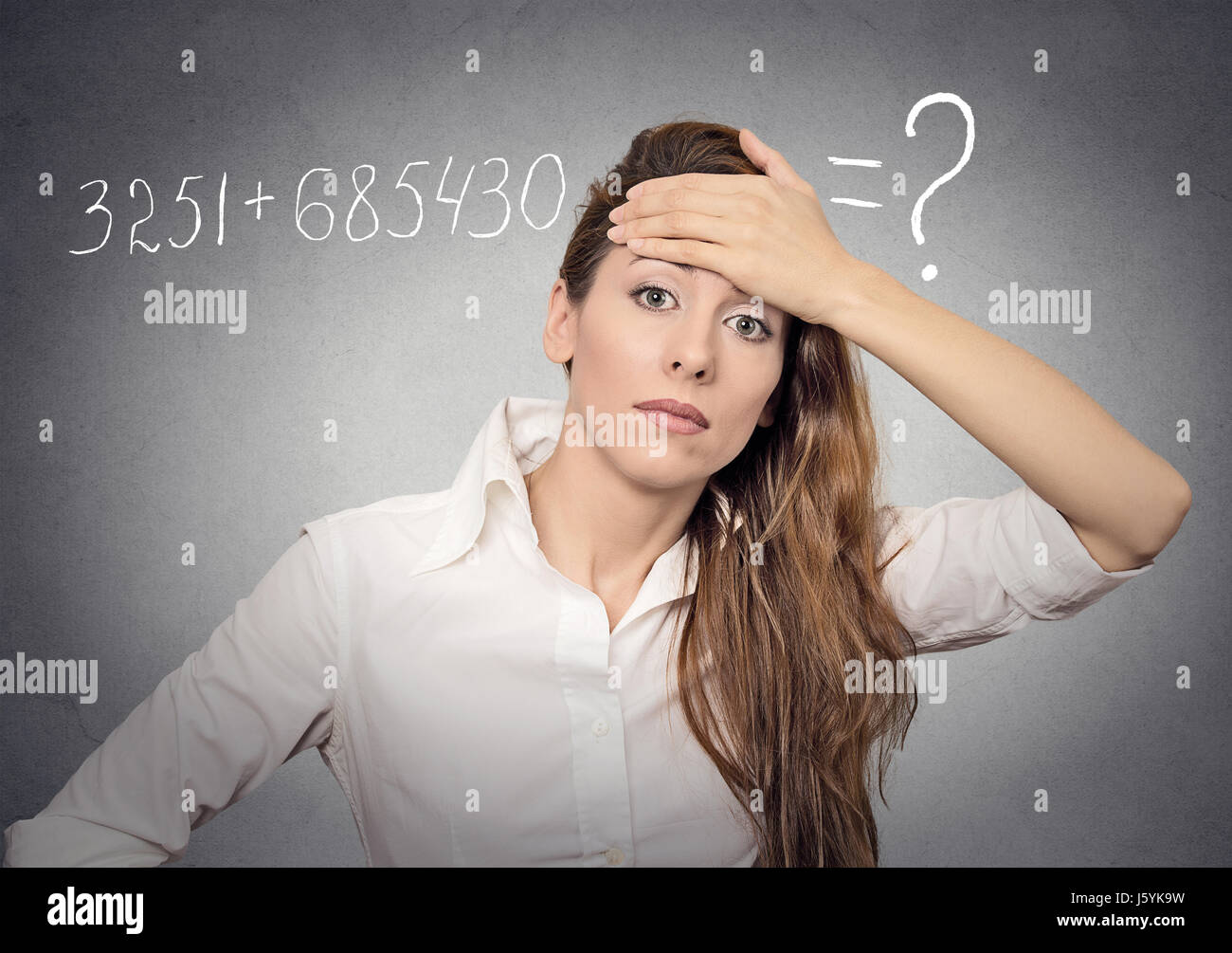 Stressed young woman can't solve math problem on her mind having ...