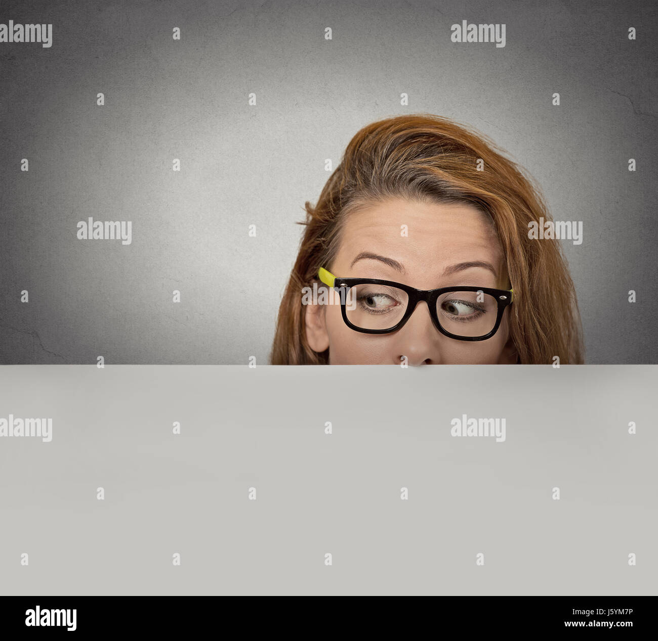 Banner sign woman peeking over edge of blank empty paper billboard ...
