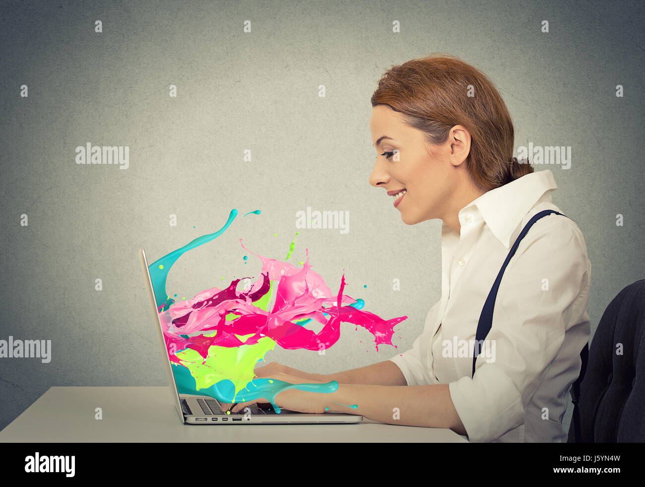 Side view profile attractive happy young business woman working on ...