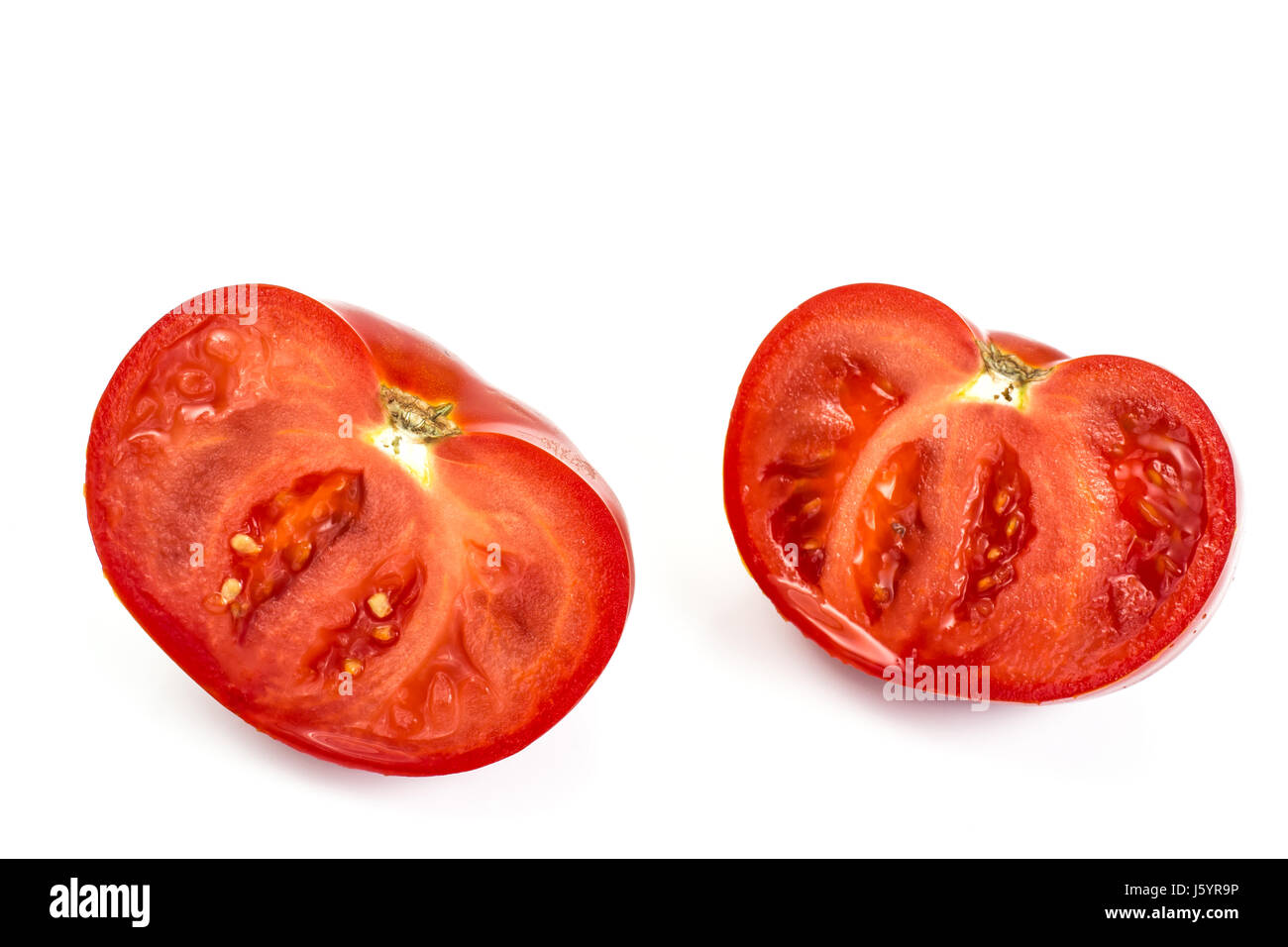 Red tomato, cut in half. Studio Photo Stock Photo - Alamy