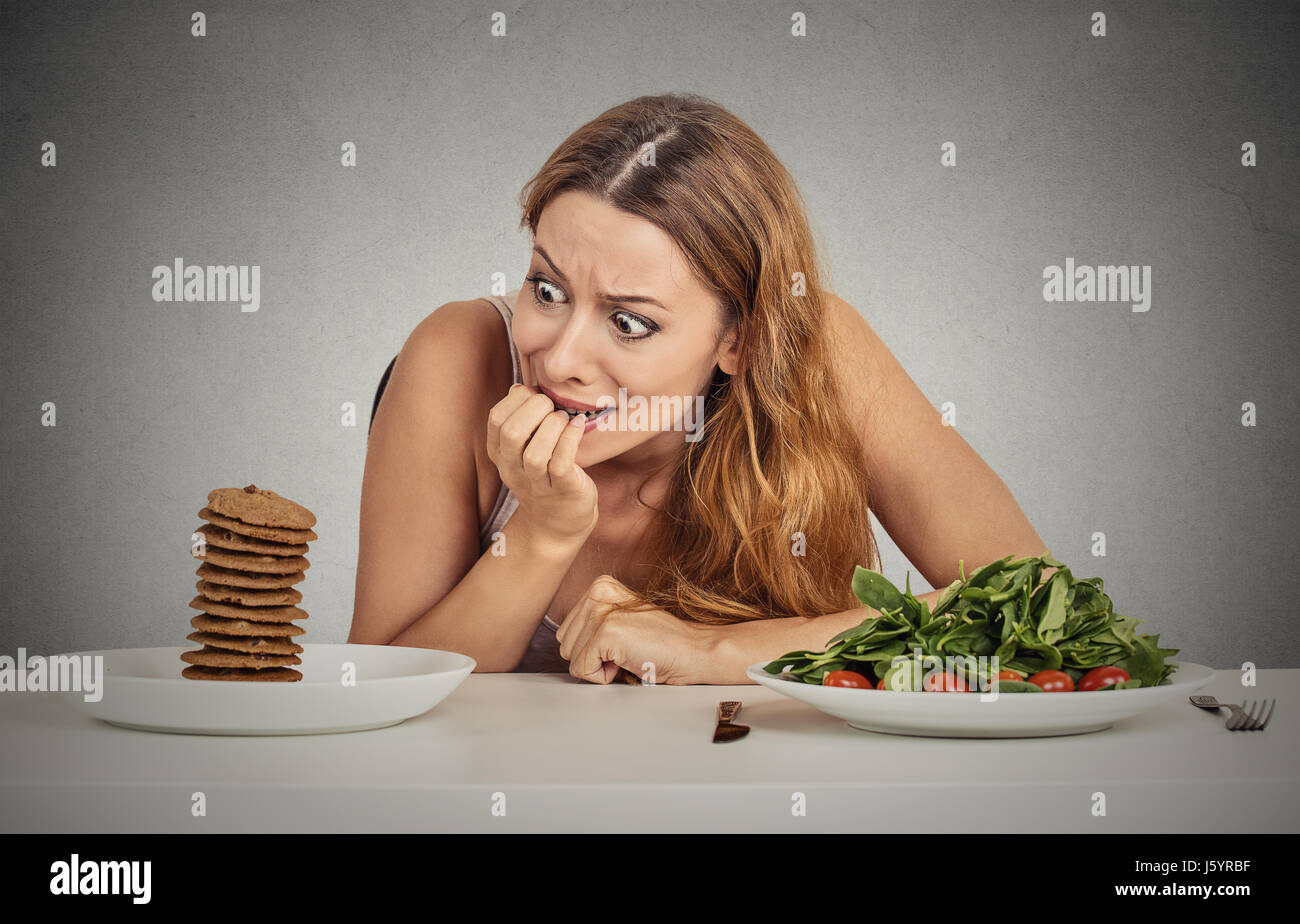 Woman overeating table hi-res stock photography and images - Alamy