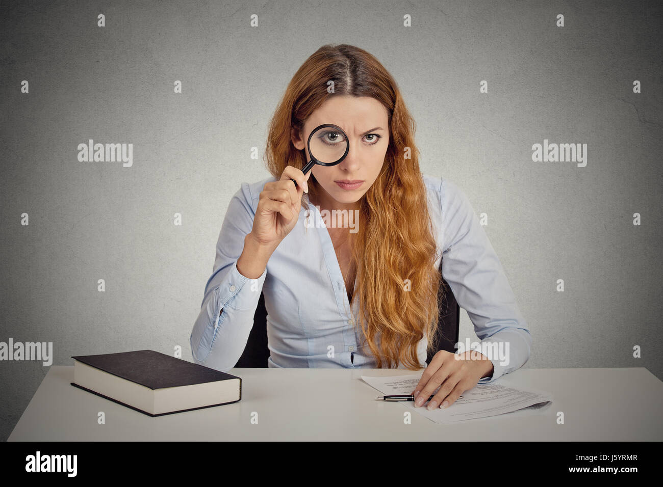 Portrait serious business woman with glasses skeptically looking at you ...