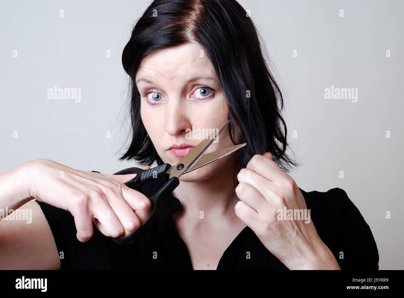 woman sad hairdo scissors scissor cut dissatisfied discontent hair hand ...