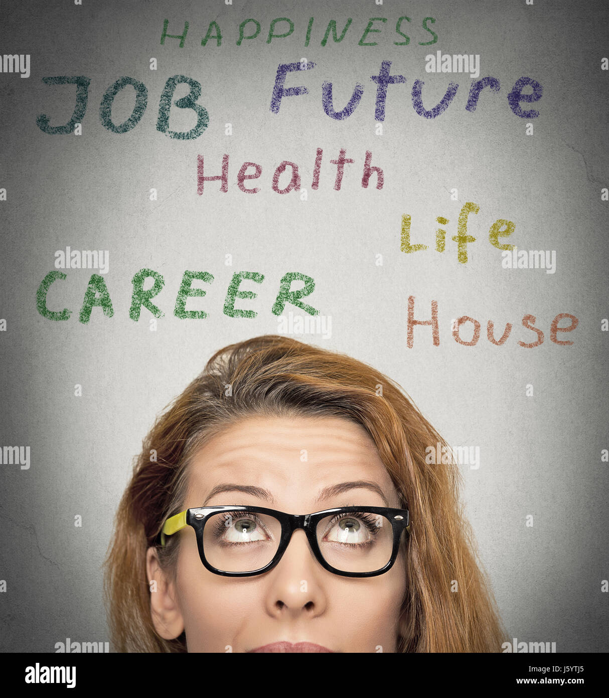 Closeup headshot worried woman with glasses looking up, isolated grey ...