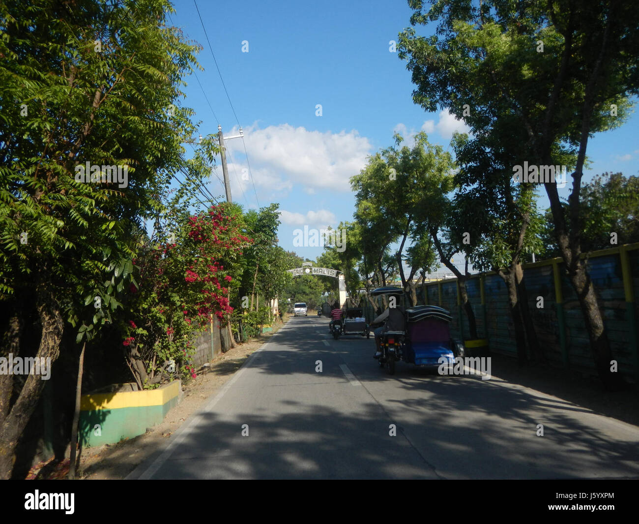 This sign marks the entrance to Guiguinto, Bulacan, with a welcoming ...