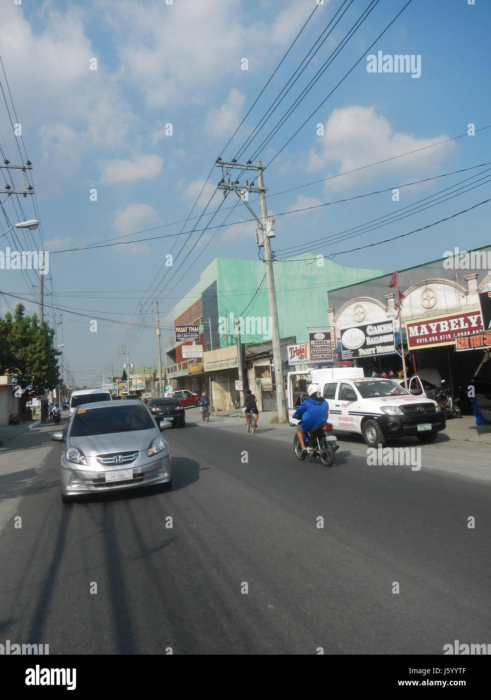 This image captures the scene along Magalang Road in Pandan, featuring ...