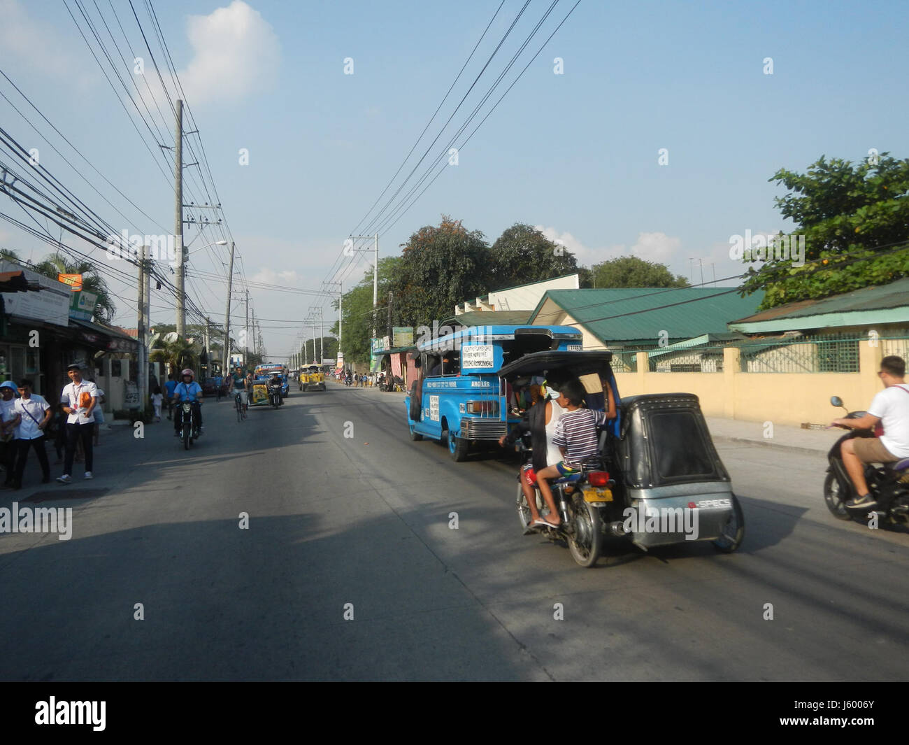 This image captures the landscape of Magalang Road in Angeles City ...