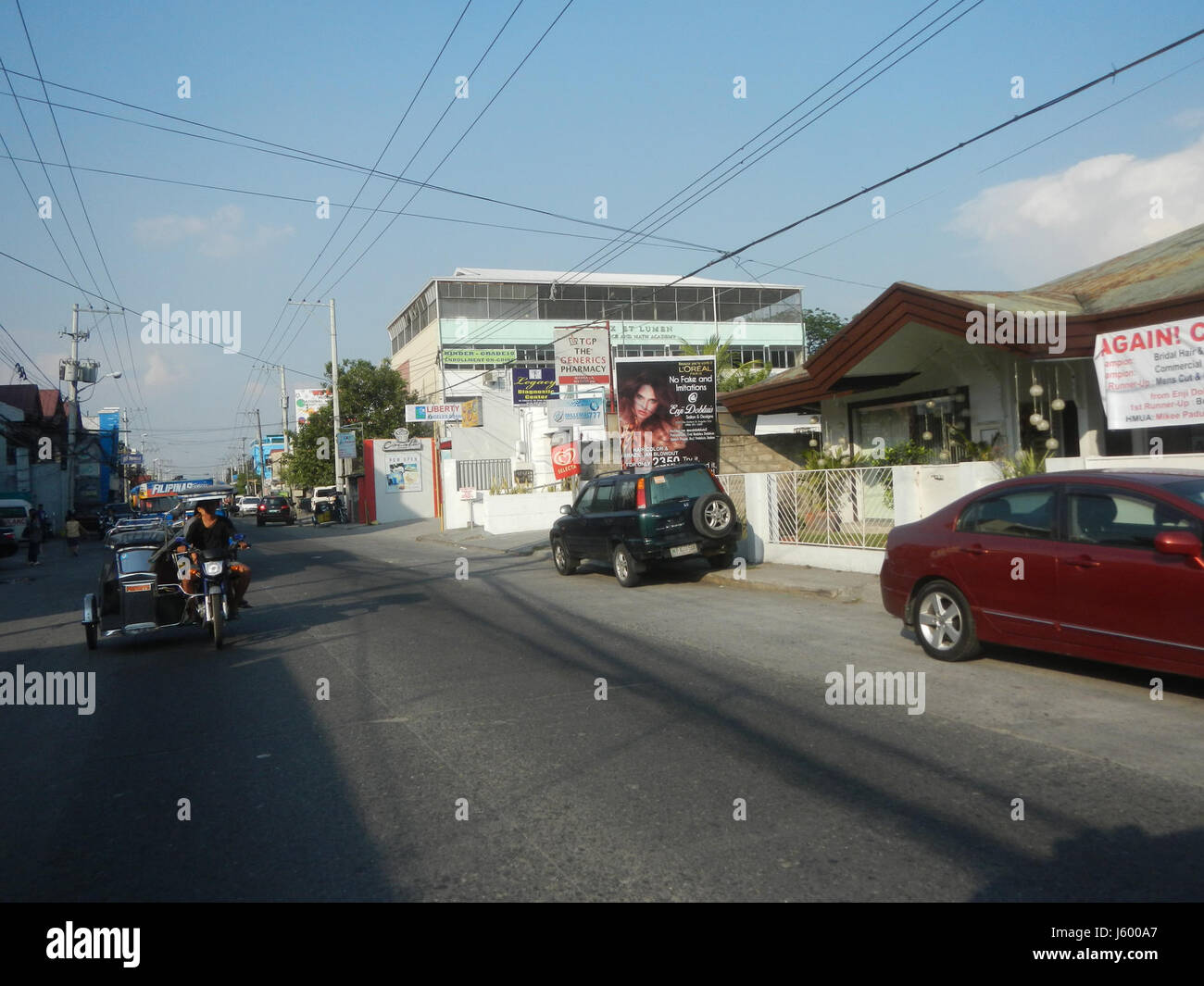 This image showcases the Magalang Road in the Pampanga province of the ...