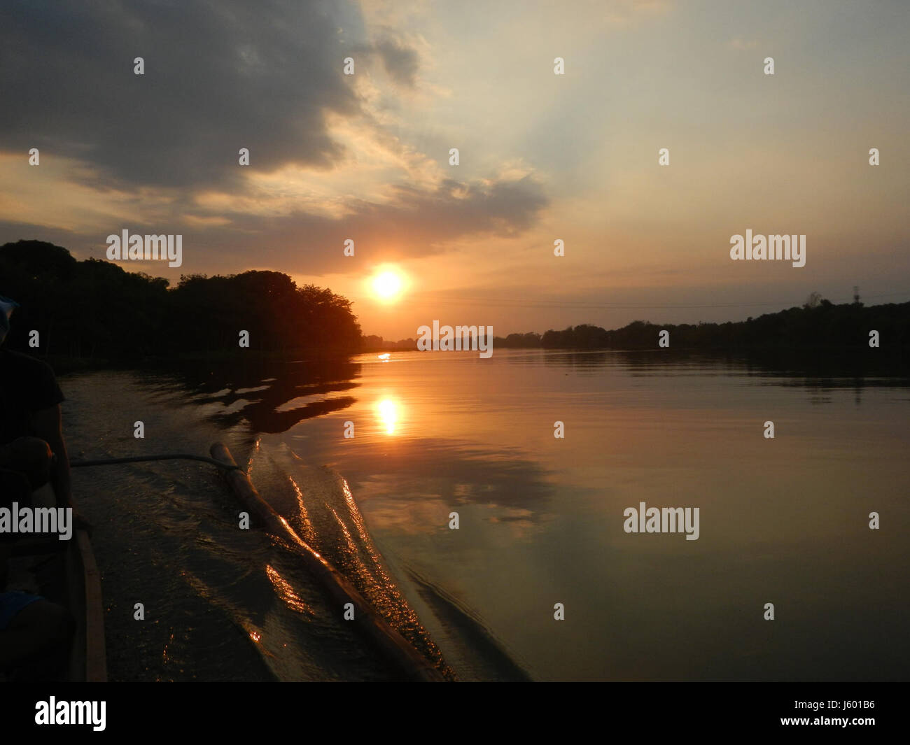 The sunsets over the riverside districts of Calumpit, Bulacan, offer a ...