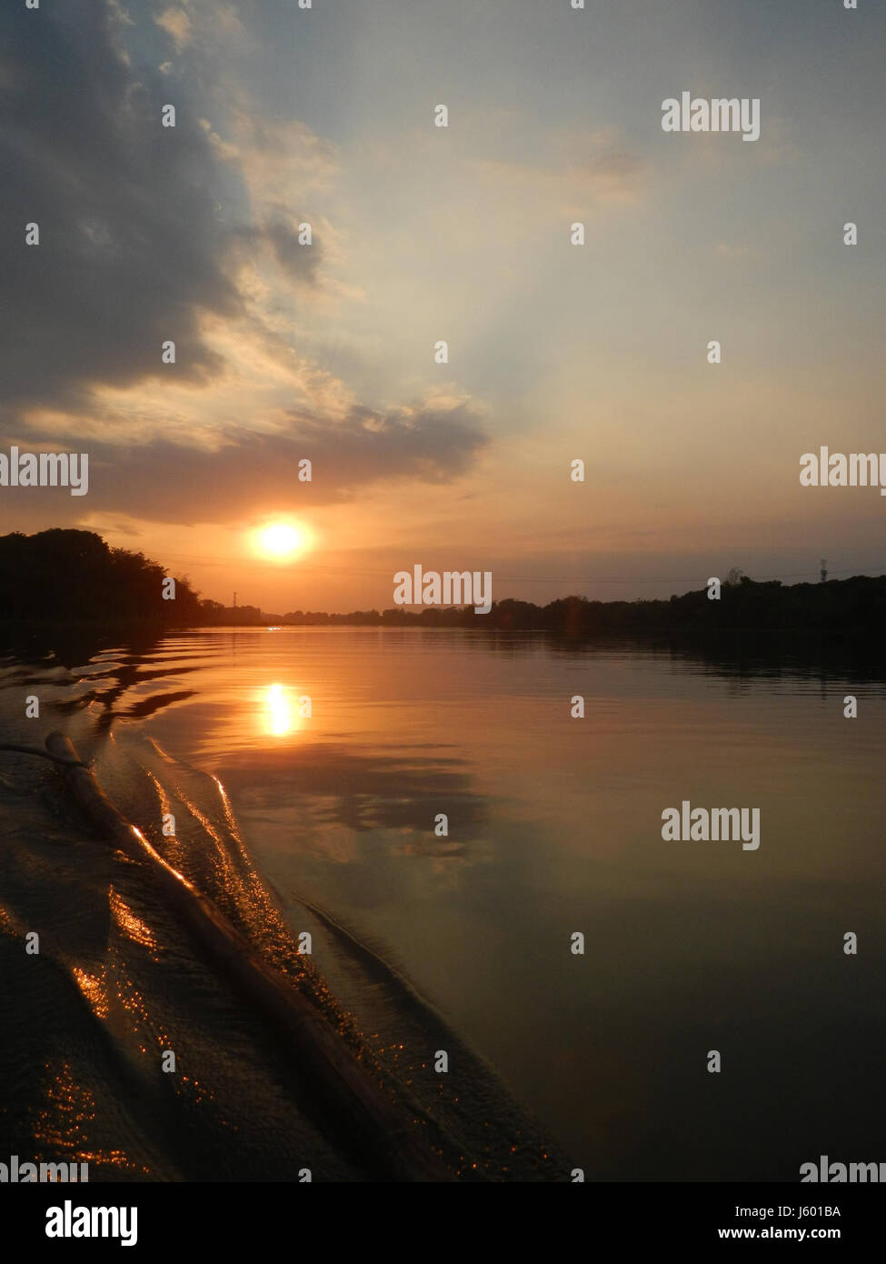 This image captures the tranquil beauty of sunsets in the Riverside ...