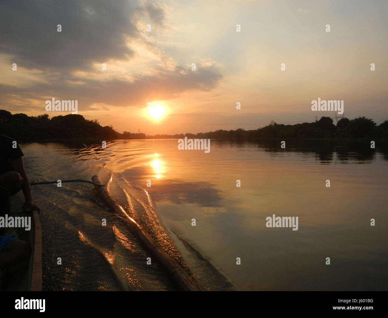 The photograph captures the serene and colorful sunsets over the ...