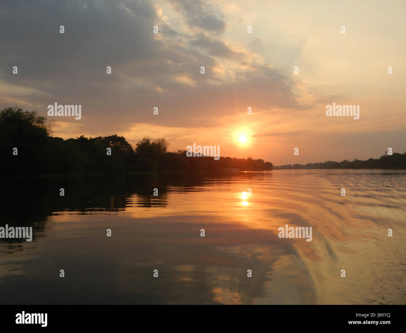 The sunsets over the riverside districts of Calumpit, Bulacan, are ...