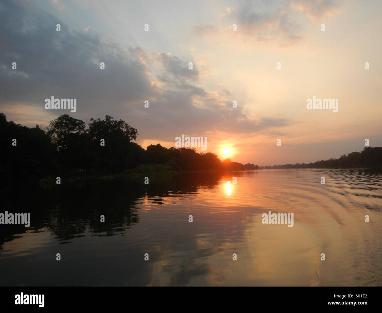 The scenic view of a sunset in Calumpit, Bulacan, showcases the natural ...