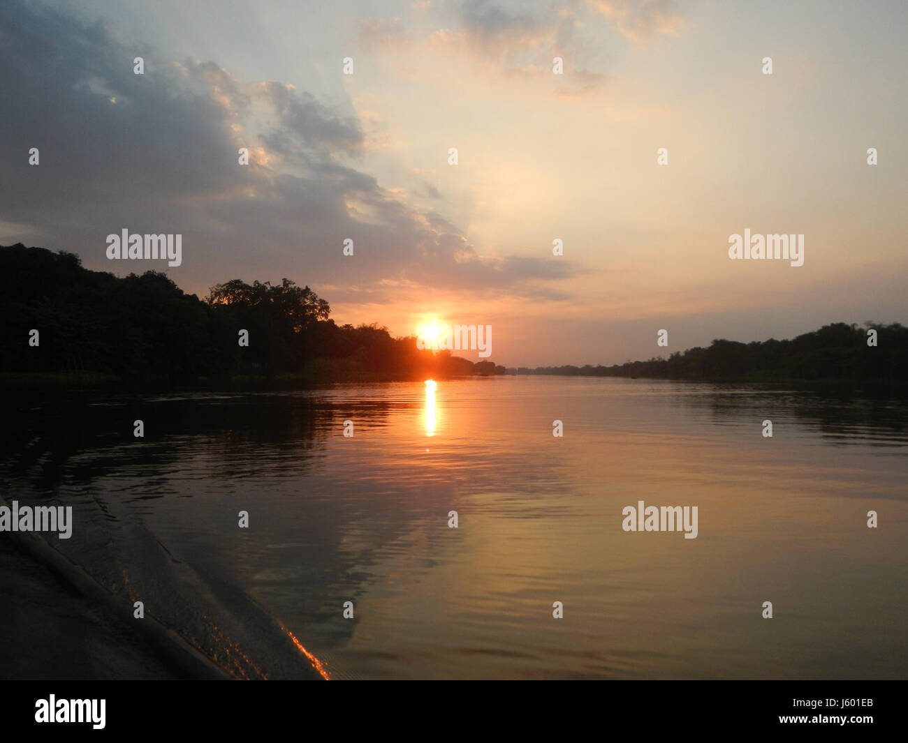 This photograph captures the stunning sunsets over the riverside ...
