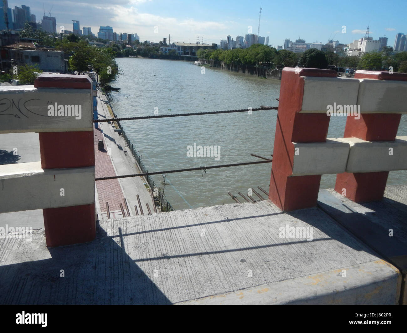 The image captures flood control efforts near Sumilang Buting Bridge in ...