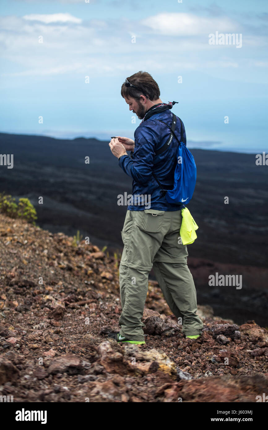 Hiker on top of a volcano in the Galapagos Stock Photo - Alamy