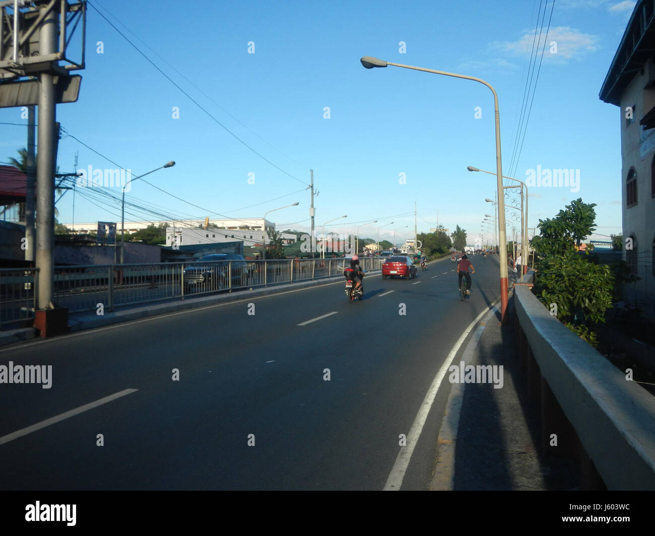 This image shows the Vargas Bridge spanning over the Pasig River ...