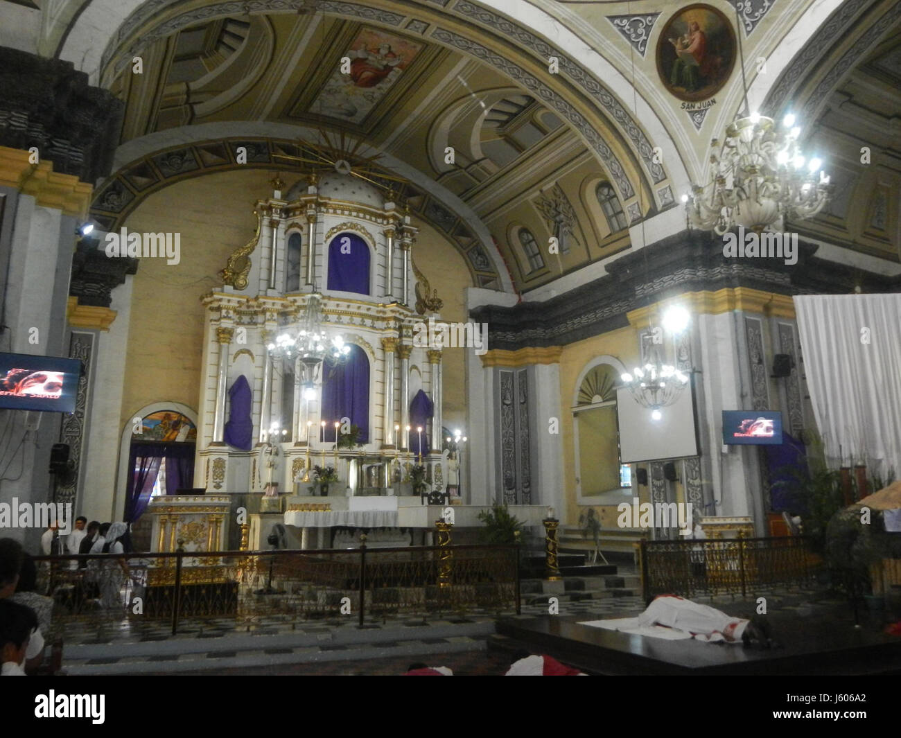 This photo depicts the Good Friday veneration of the cross at San Pedro ...
