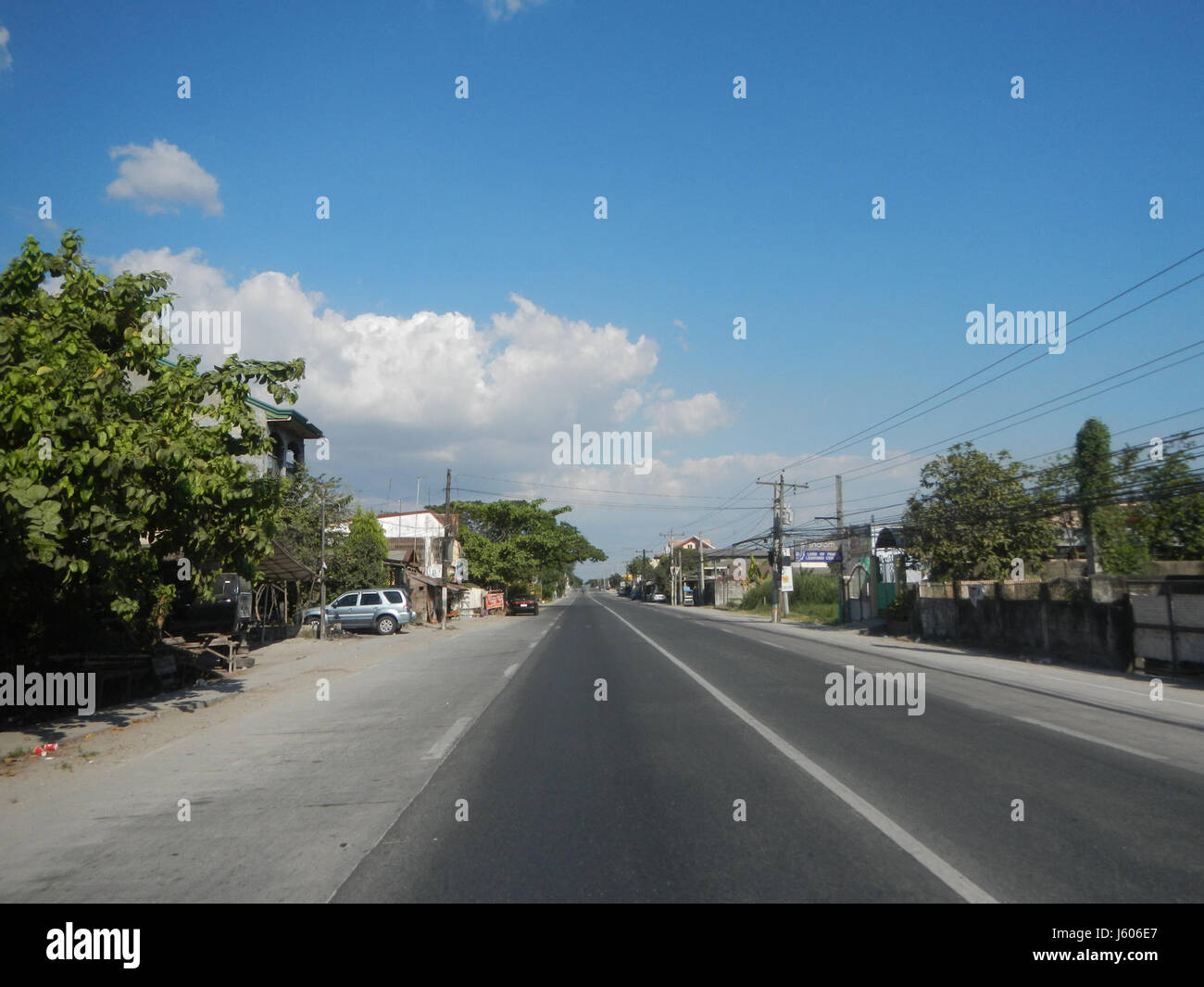 The image showcases MacArthur Highway in Pampanga, Philippines, with ...