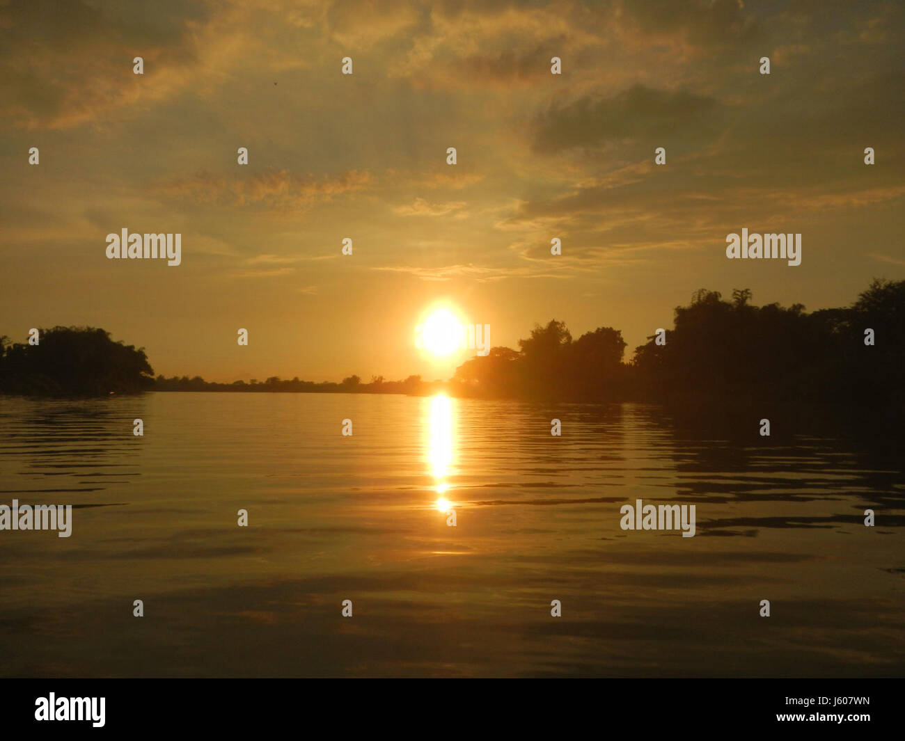 The sunsets over the Pampanga River in San Juan, Santa Cruz, Pambilog ...