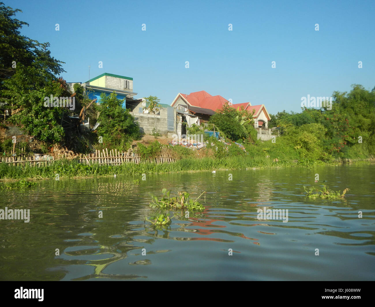 The banks of the Pampanga River, flowing through the provinces of ...