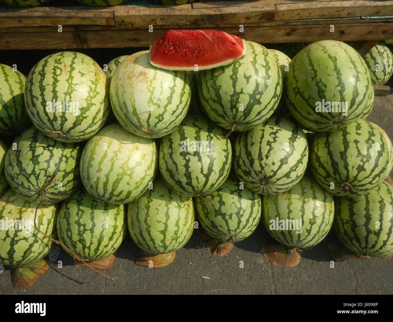 This photo captures a vibrant display of watermelons at the Apolonio ...