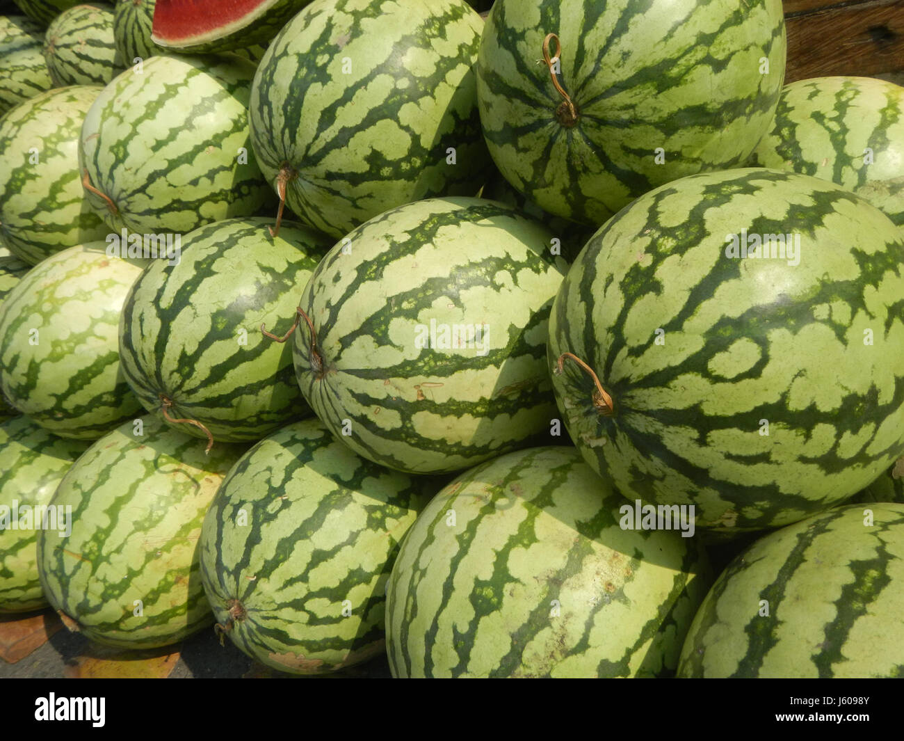 This image shows watermelons for sale at the Apolonio Samson Market in ...