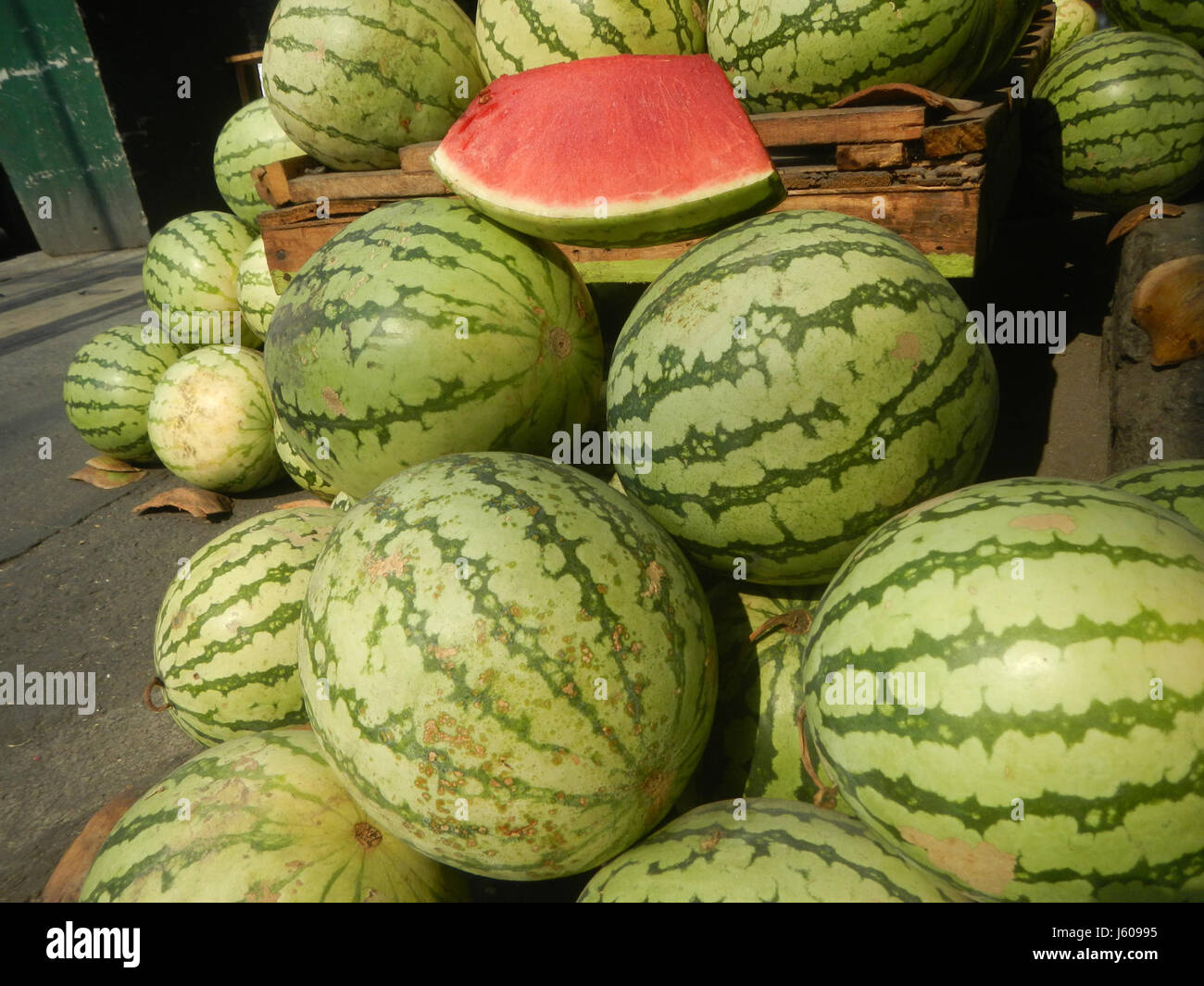 This image depicts watermelons at the Apolonio Samson Market in Quezon ...