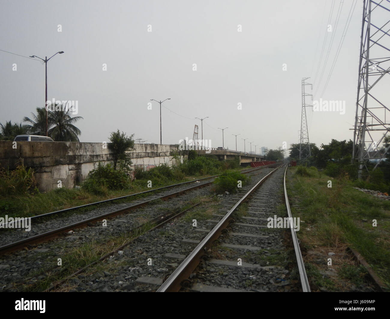 This photograph captures the Santa Mesa PNR Station in Manila, with the ...