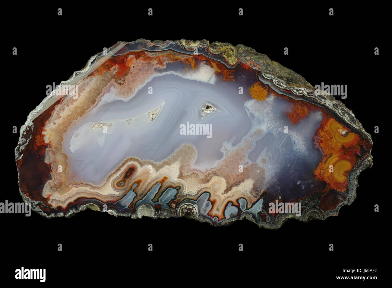 A cross section of the agate stone. At the bottom are the chalcedony ...